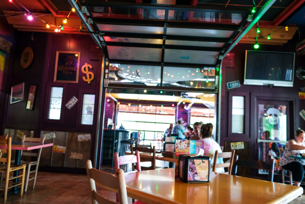 Try the best street tacos + mile-high nachos at Nacho Hippo